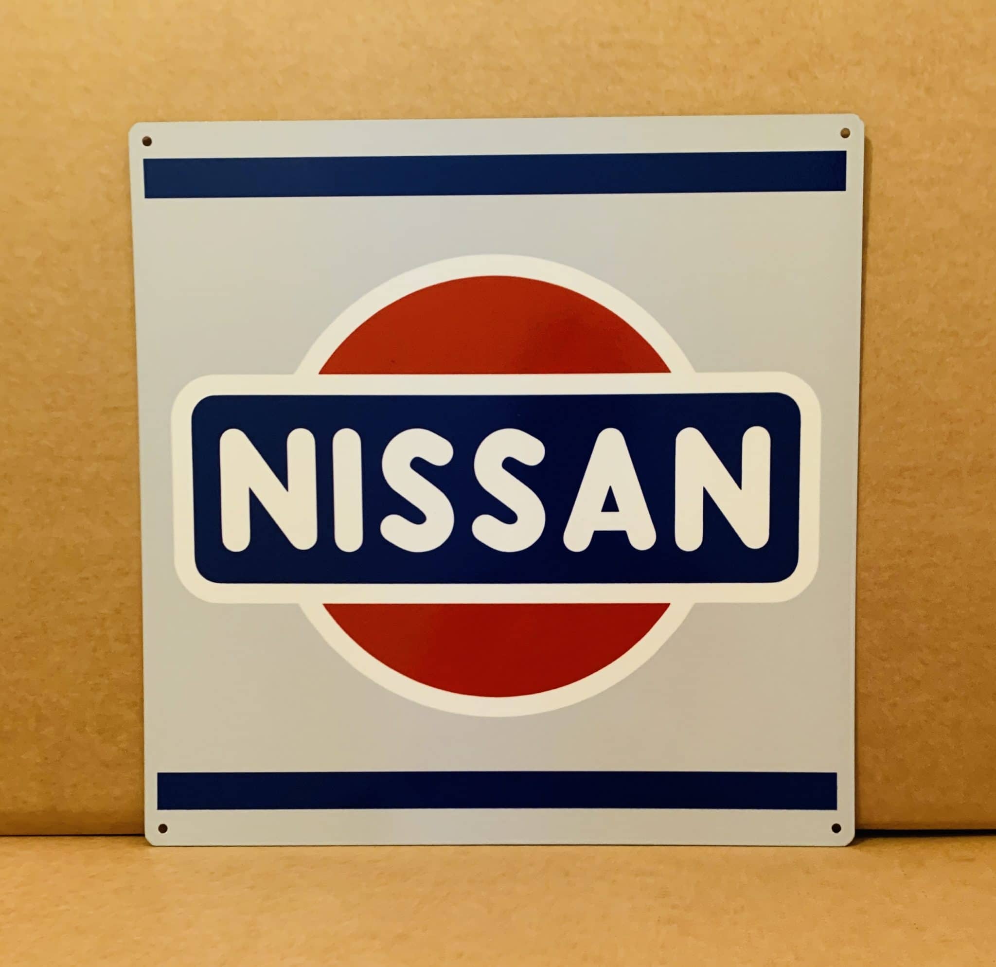 Nissan logo tin metal sign - Nostalgia Highway
